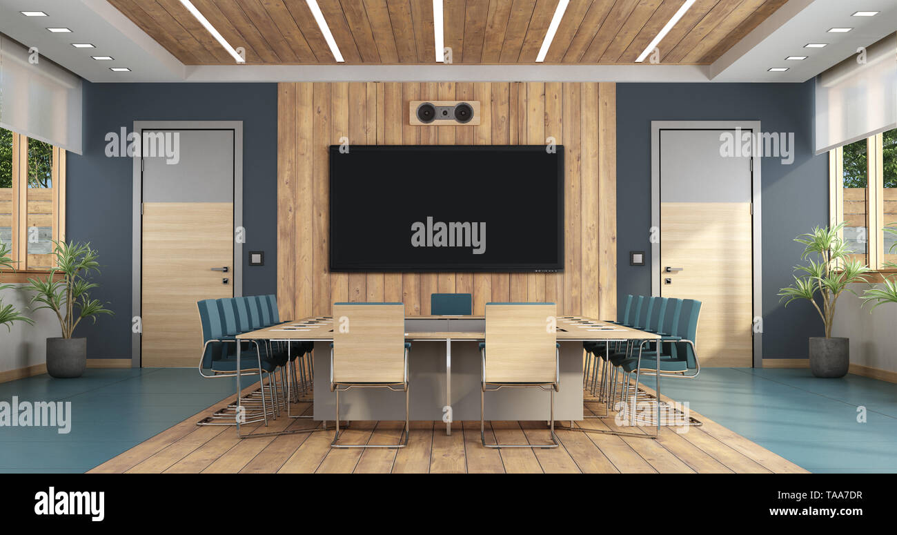 Elegant boardroom with large meeting table,two doors and flat screen on ...