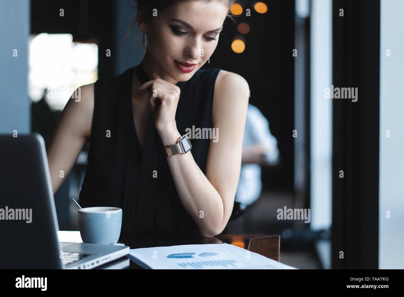Concentrated at work. Confident young woman in smart casual wear ...
