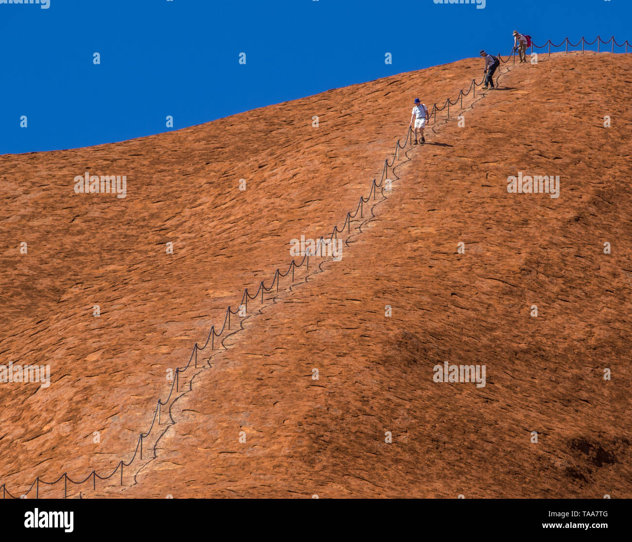 View of some people climbing Uluru/Ayers Rock in Australia's Red Centre ...