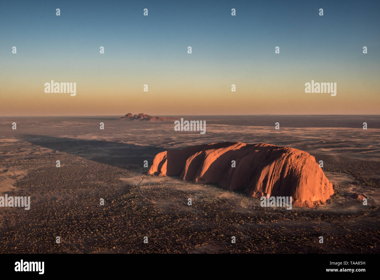 Australia's Uluru/Ayers Rock viewed from the air in the early morning ...