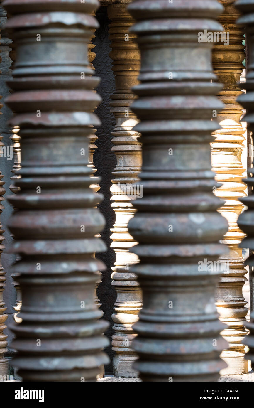 Stone pillar window decor of ancient temple in Angkor Wat complex ...