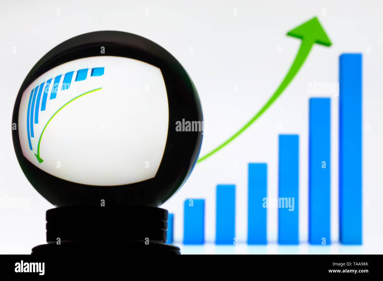 Crystal ball on the background of the upward or downward graph, a ...