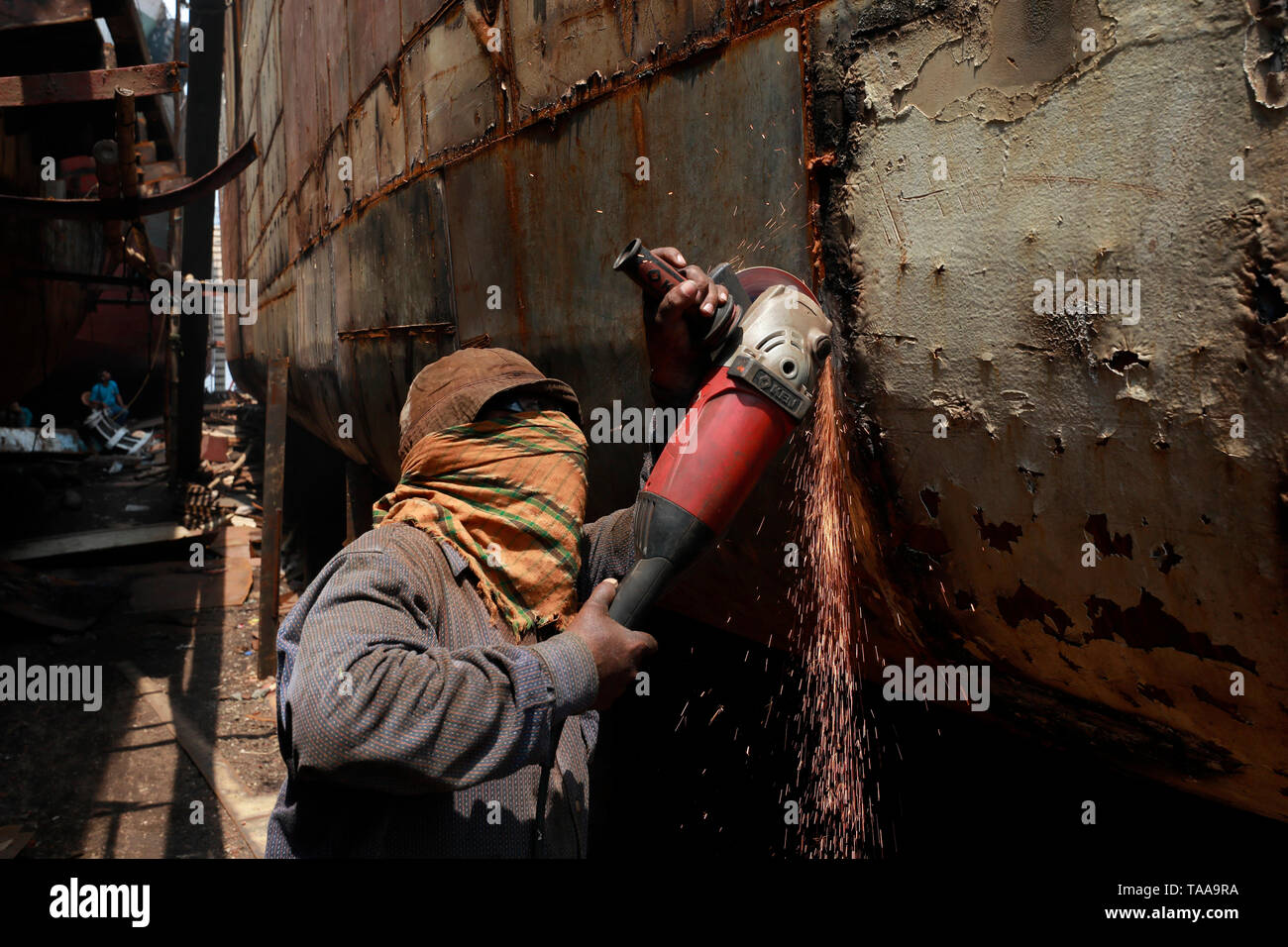 Dhaka, Bangladesh - May 23, 2019: Bangladeshi laborers works on a ferry ...