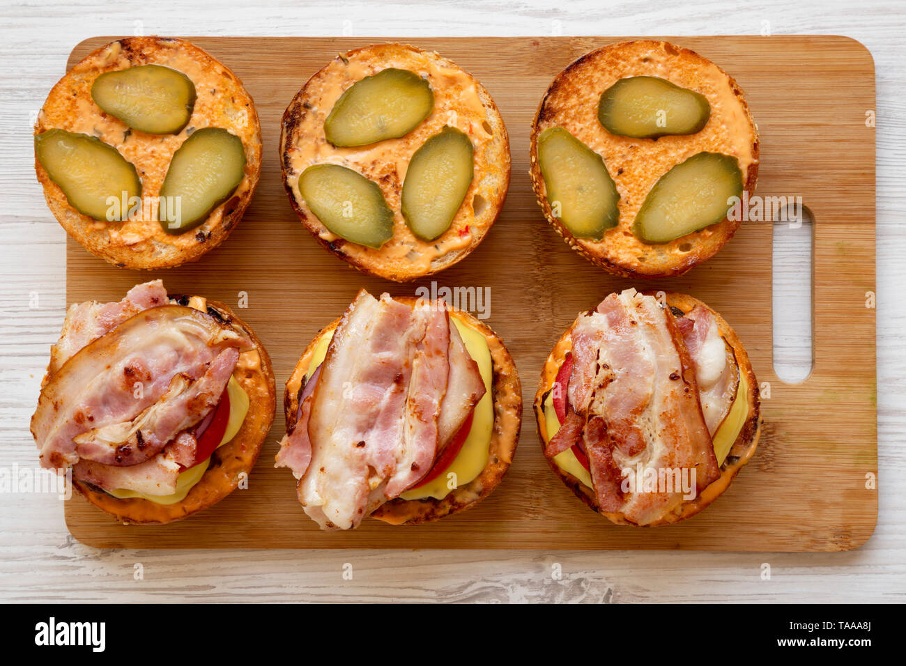 Cooking cheeseburger step-by-step, top view. Flat lay, from above ...
