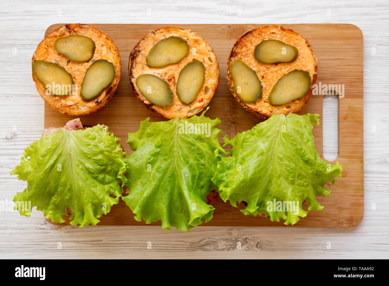 Cooking cheeseburger step-by-step, top view. Flat lay, from above ...