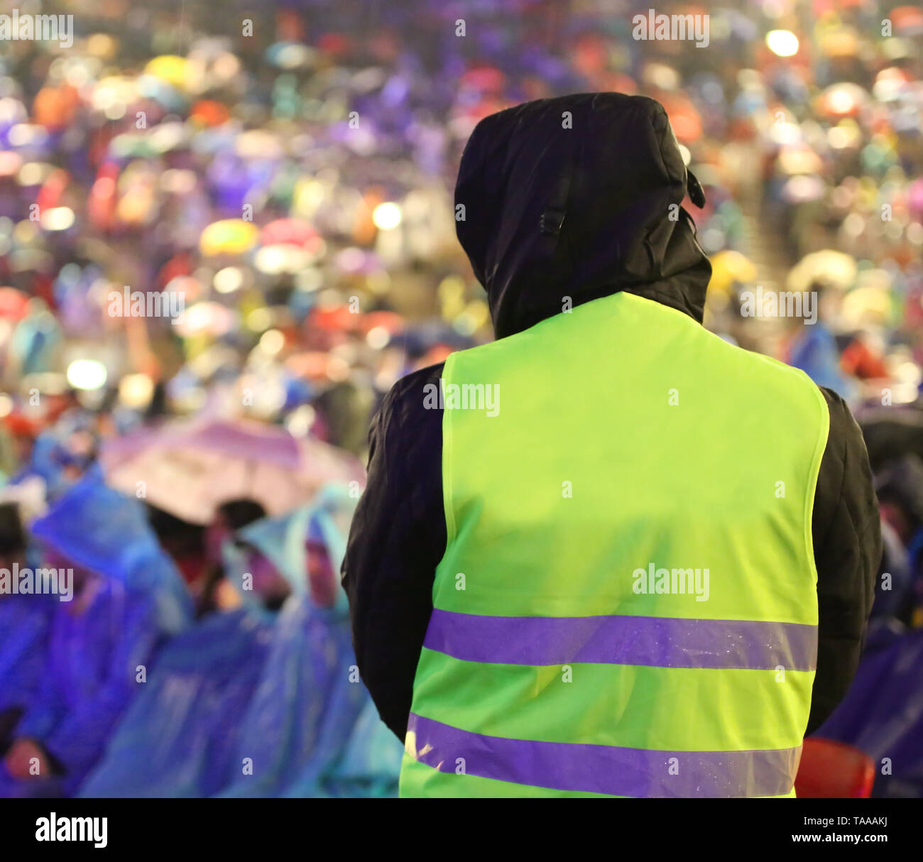 boy with yellow high visibility jacket before the outdoor event while ...