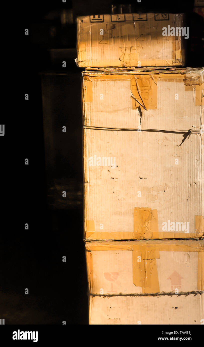 The old cardboard box on a black background.cargo.post.shipment ...