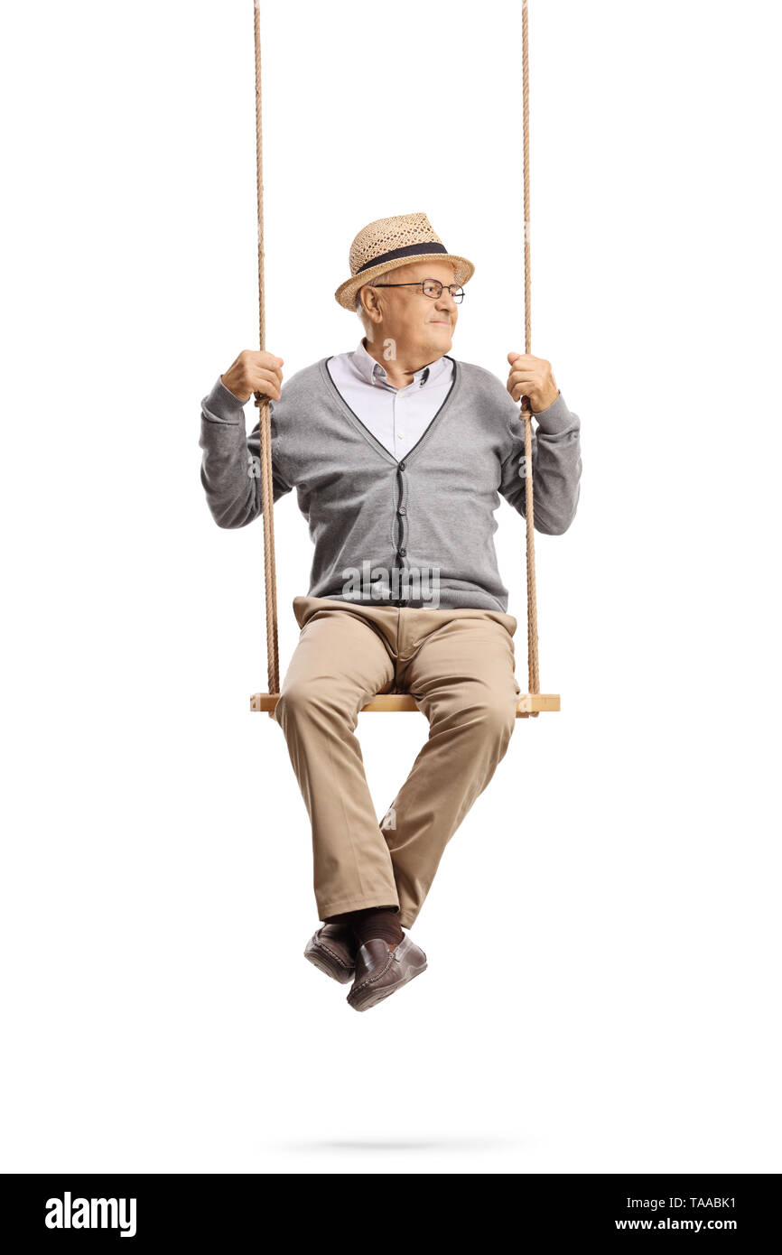 Full length portrait of a senior man sitting on a swing and looking ...