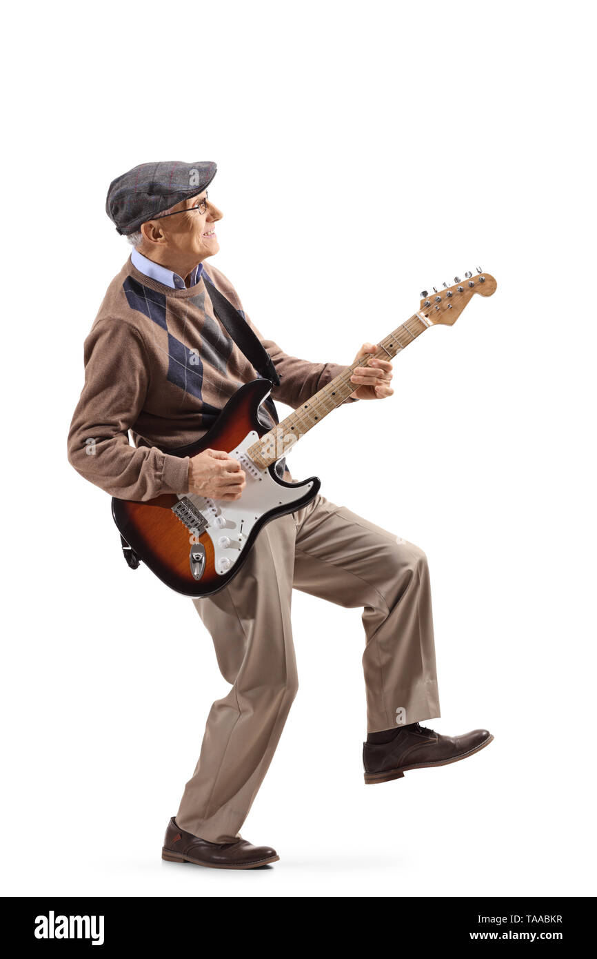 Full length shot of a senior man playing an electric guitar isolated on ...