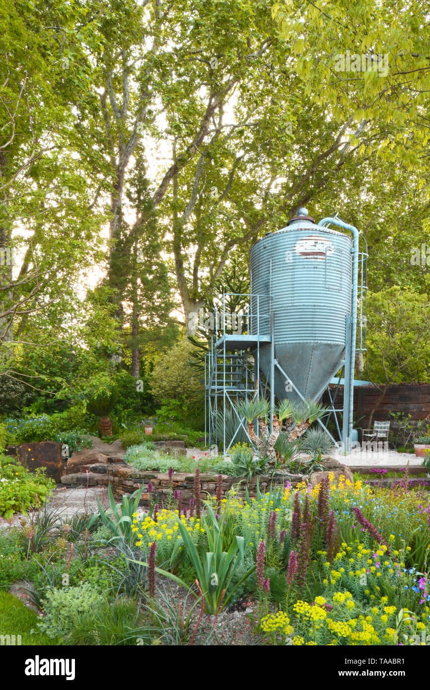 A repurposed grain silo surrounded by naturalistic planting in the ...