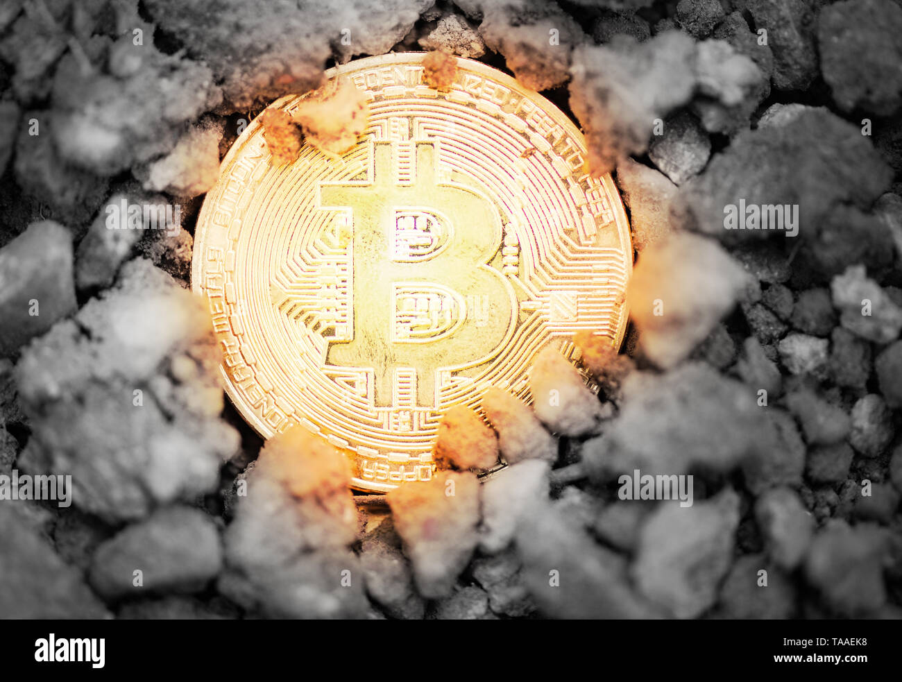 Bitcoin Golden on ground soil deep with light / Virtual cryptocurrency ...