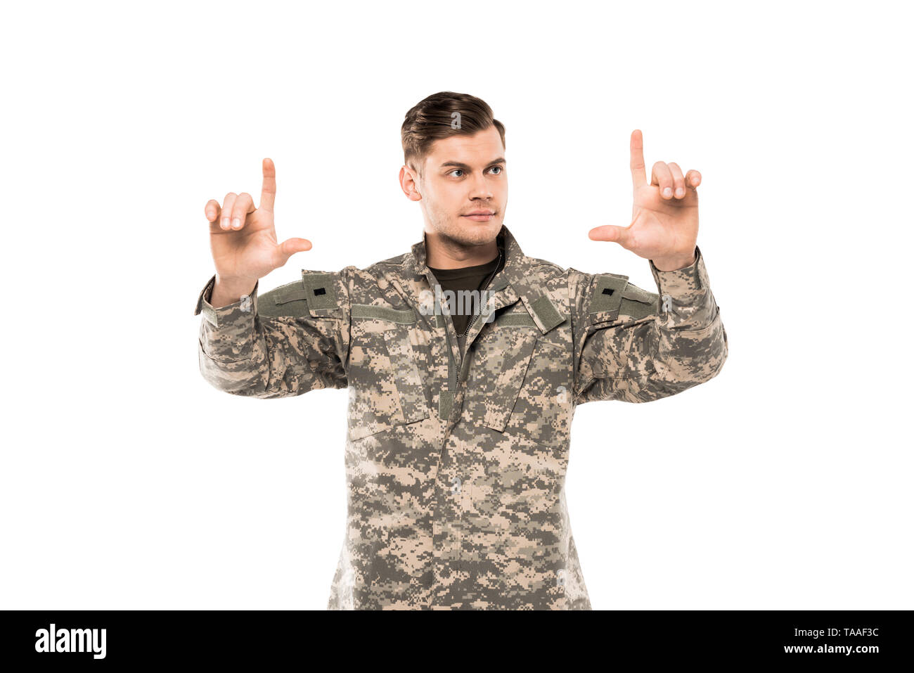 handsome man in military uniform pointing with fingers isolated on ...