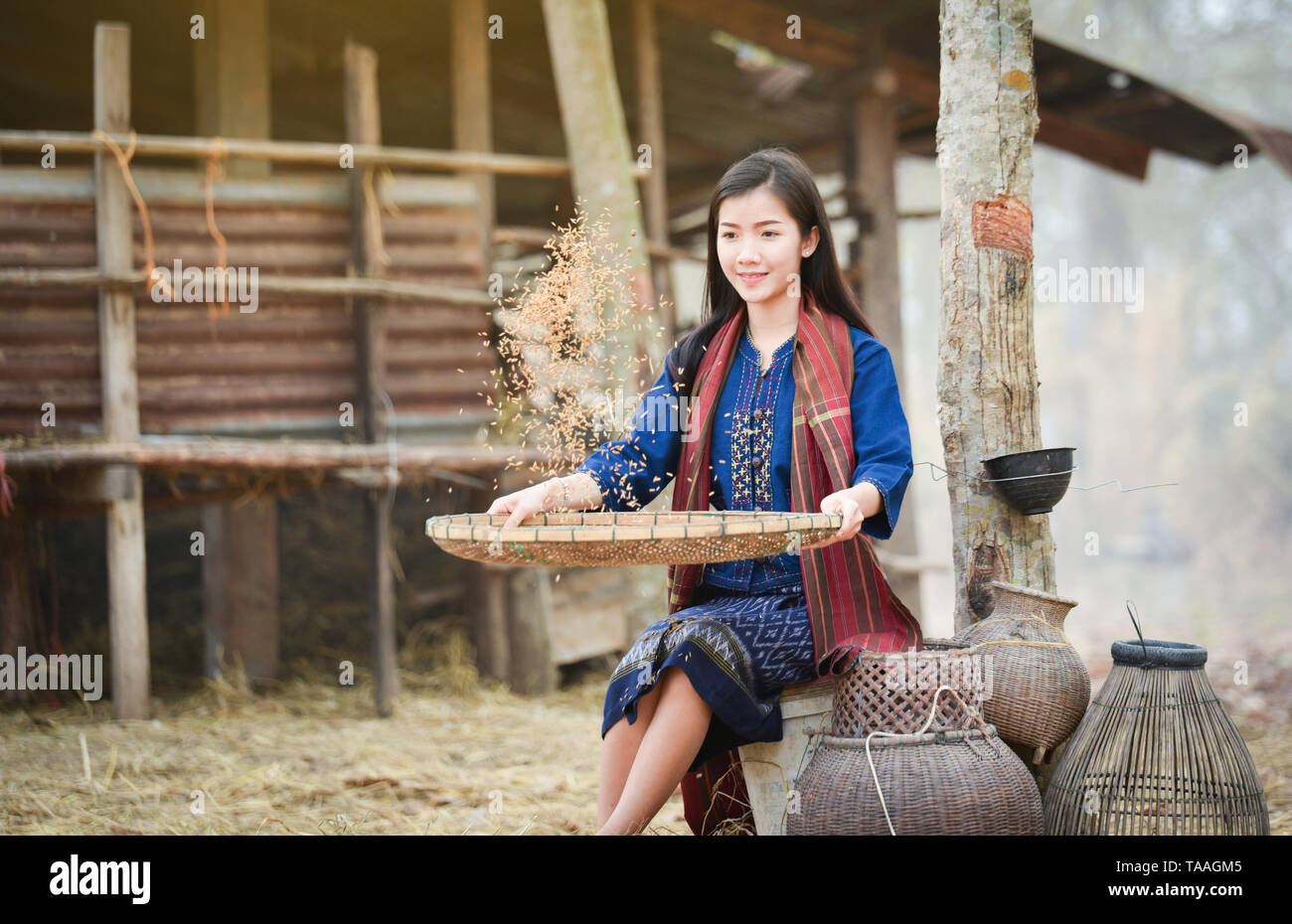 Asian Woman winnowing rice / Portrait of beautiful young woman ...