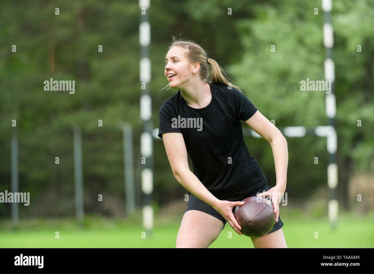 Girl playing rugby together outside in summer Stock Photo - Alamy