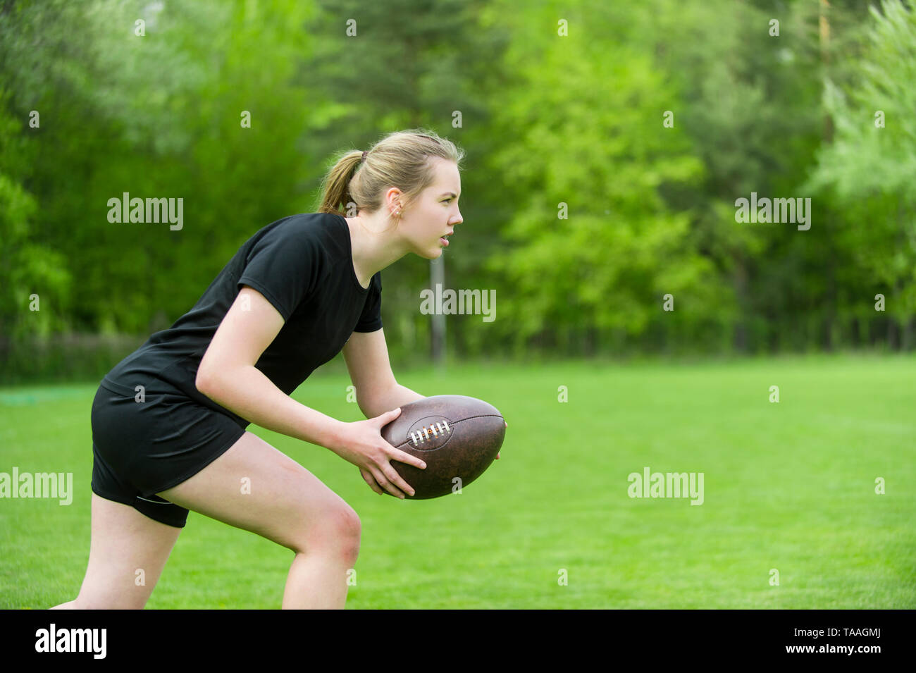Girl playing rugby together outside in summer Stock Photo - Alamy