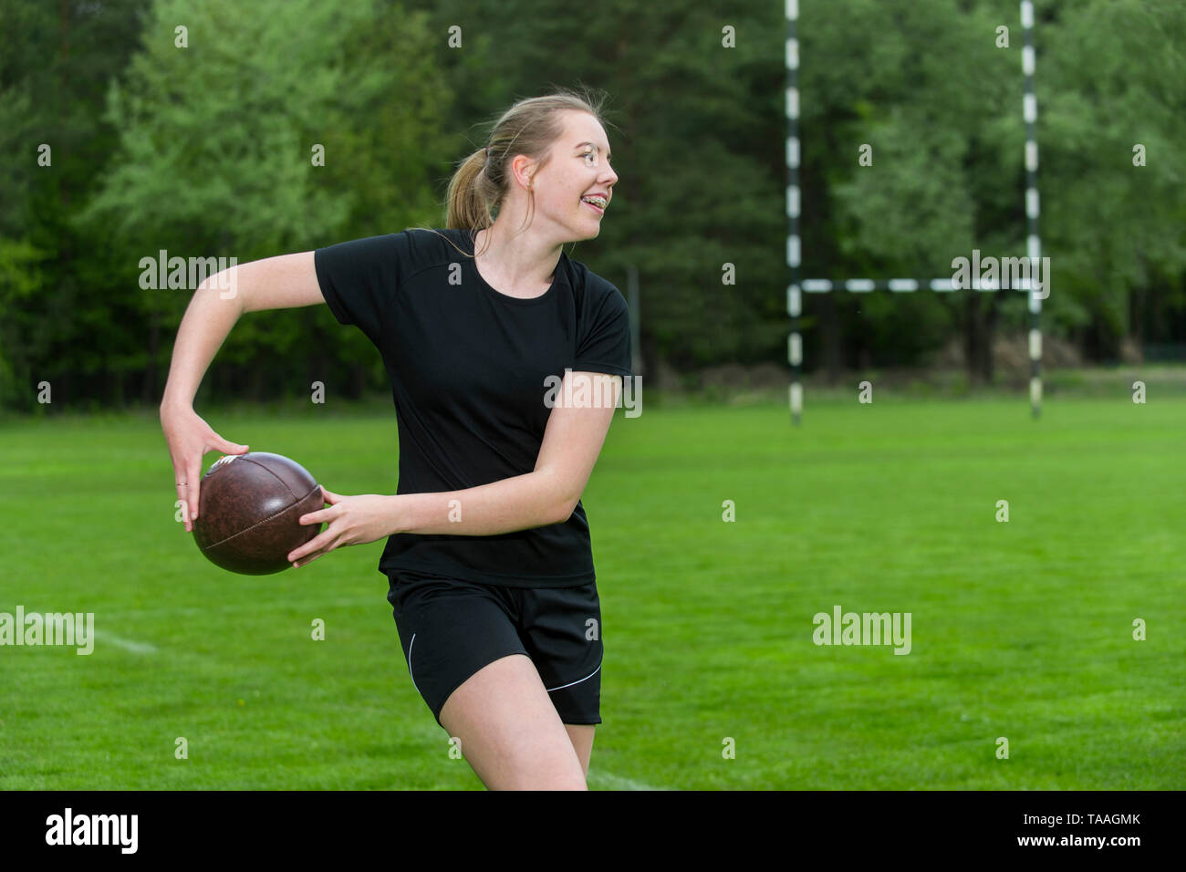 Girl playing rugby together outside in summer Stock Photo - Alamy