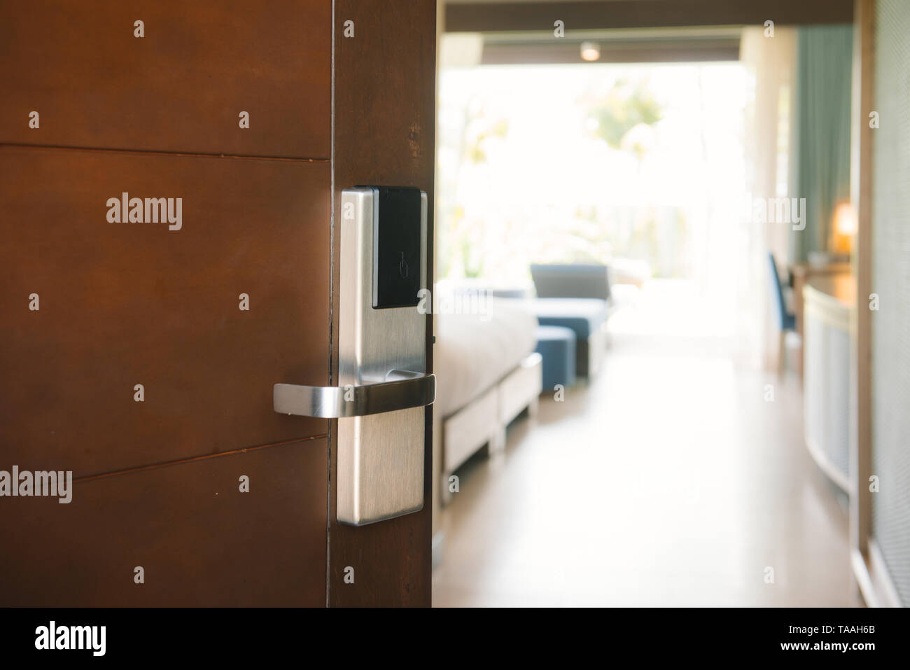 Hotel room , Condominium or apartment doorway with open door in front ...