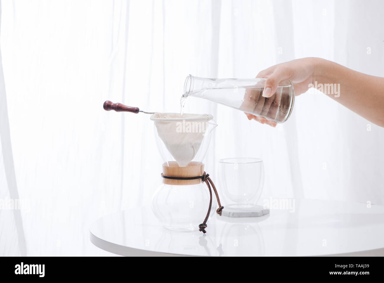Pouring Water to the Coffee Pot on White Wall and White Table, Manual ...