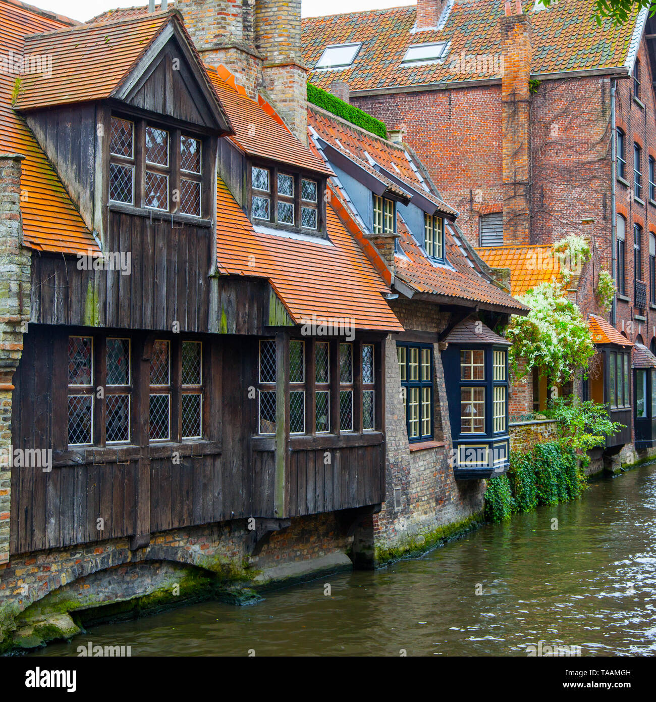 Medieval houses by canal in Bruges, Belgium Stock Photo - Alamy