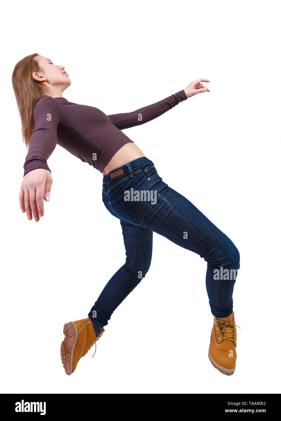 Side view of a woman dancing ballet. girl is balancing. Rear view ...