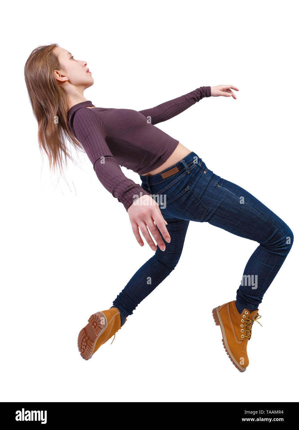 Side view of a woman dancing ballet. girl is balancing. Rear view ...