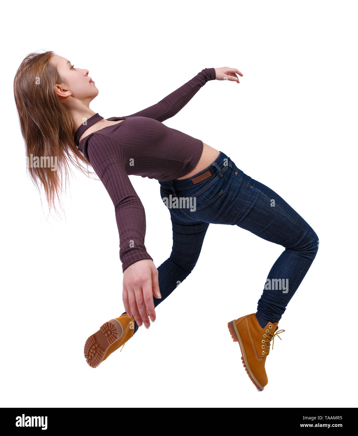 Side view of a woman dancing ballet. girl is balancing. Rear view ...