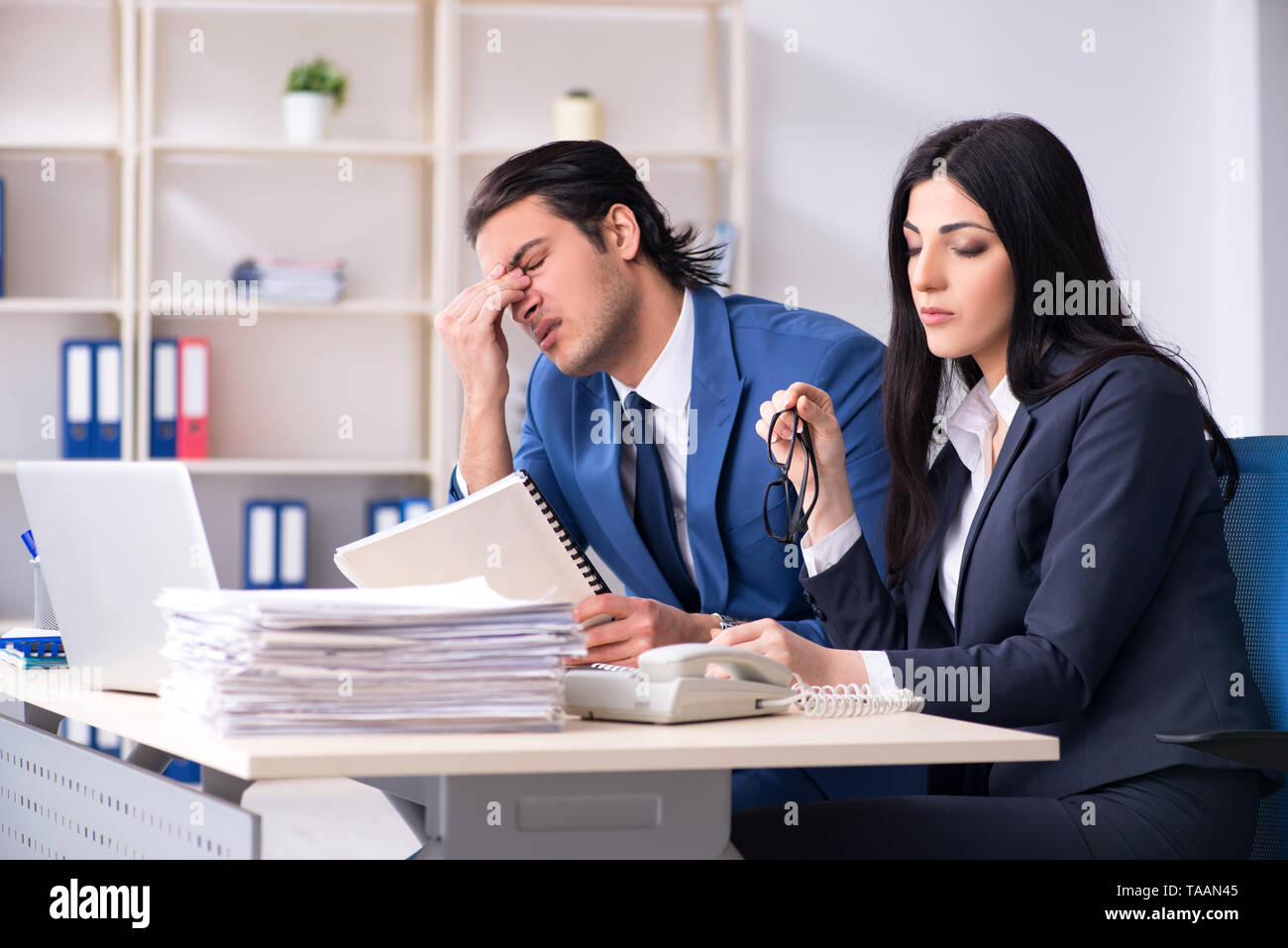 Two employees working in the office Stock Photo - Alamy