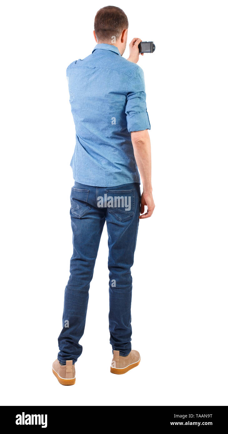 Back view of man photographing. tourist with camera. Rear view people ...