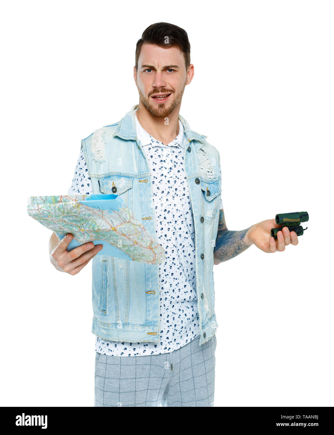 man with a map. Front view. The tourist in the denim jacket is angry or ...