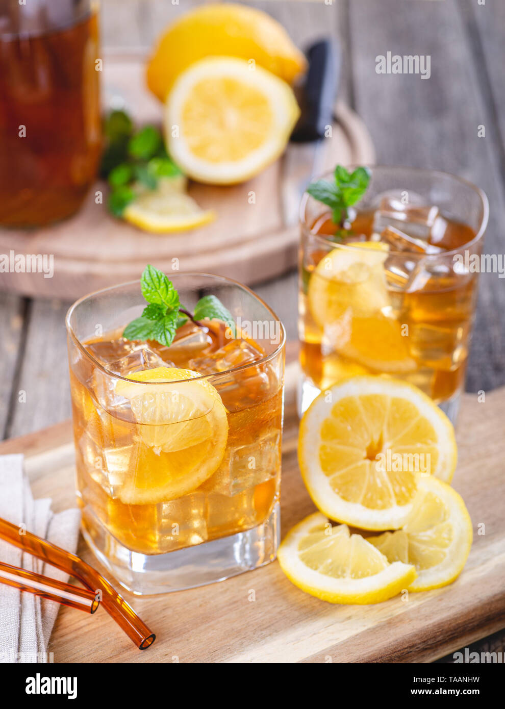 Closeup of two glasses of refreshing ice tea with lemon slices and ice ...