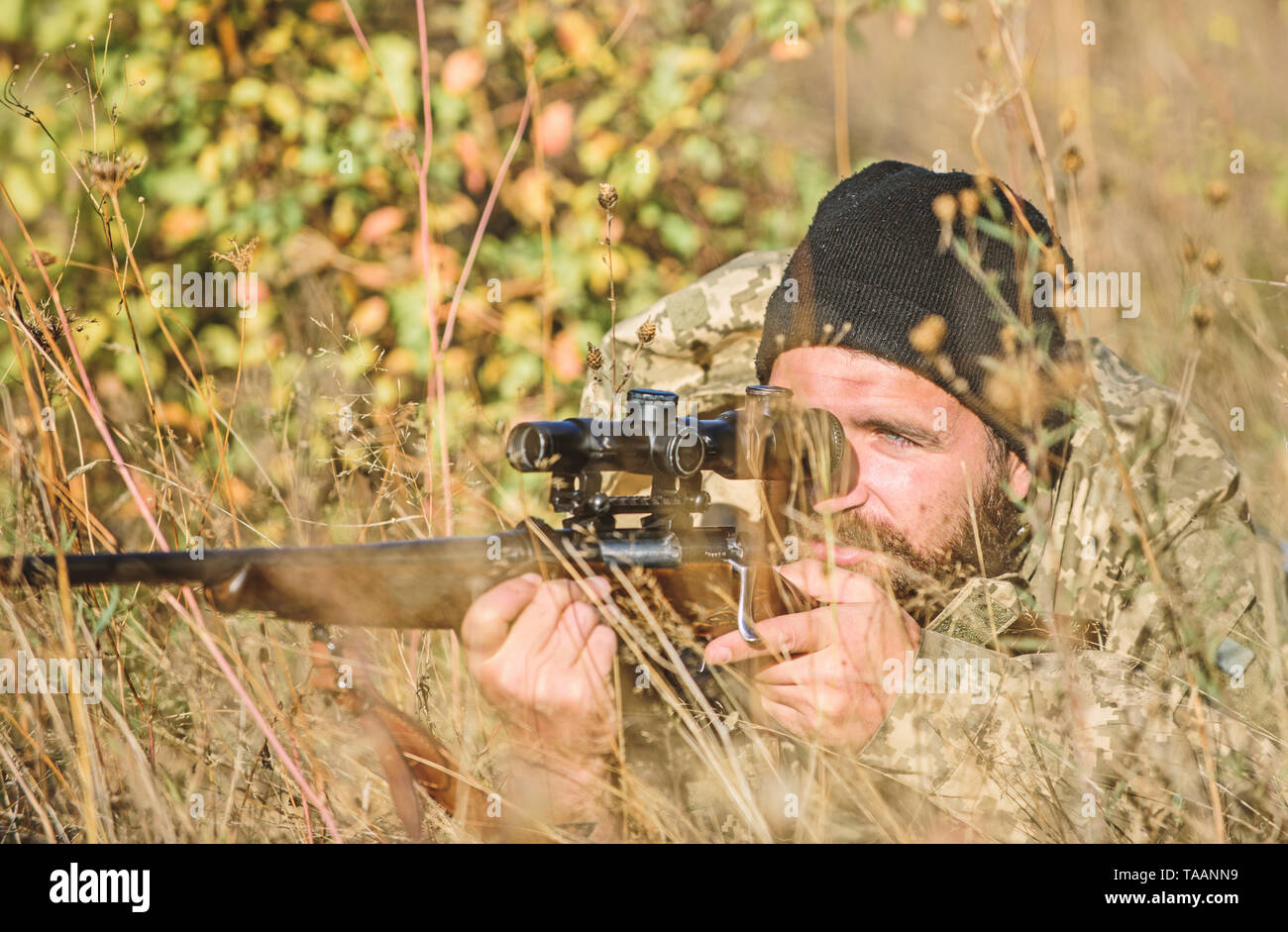 Man hunter with rifle gun. Boot camp. Bearded man hunter. Army forces ...