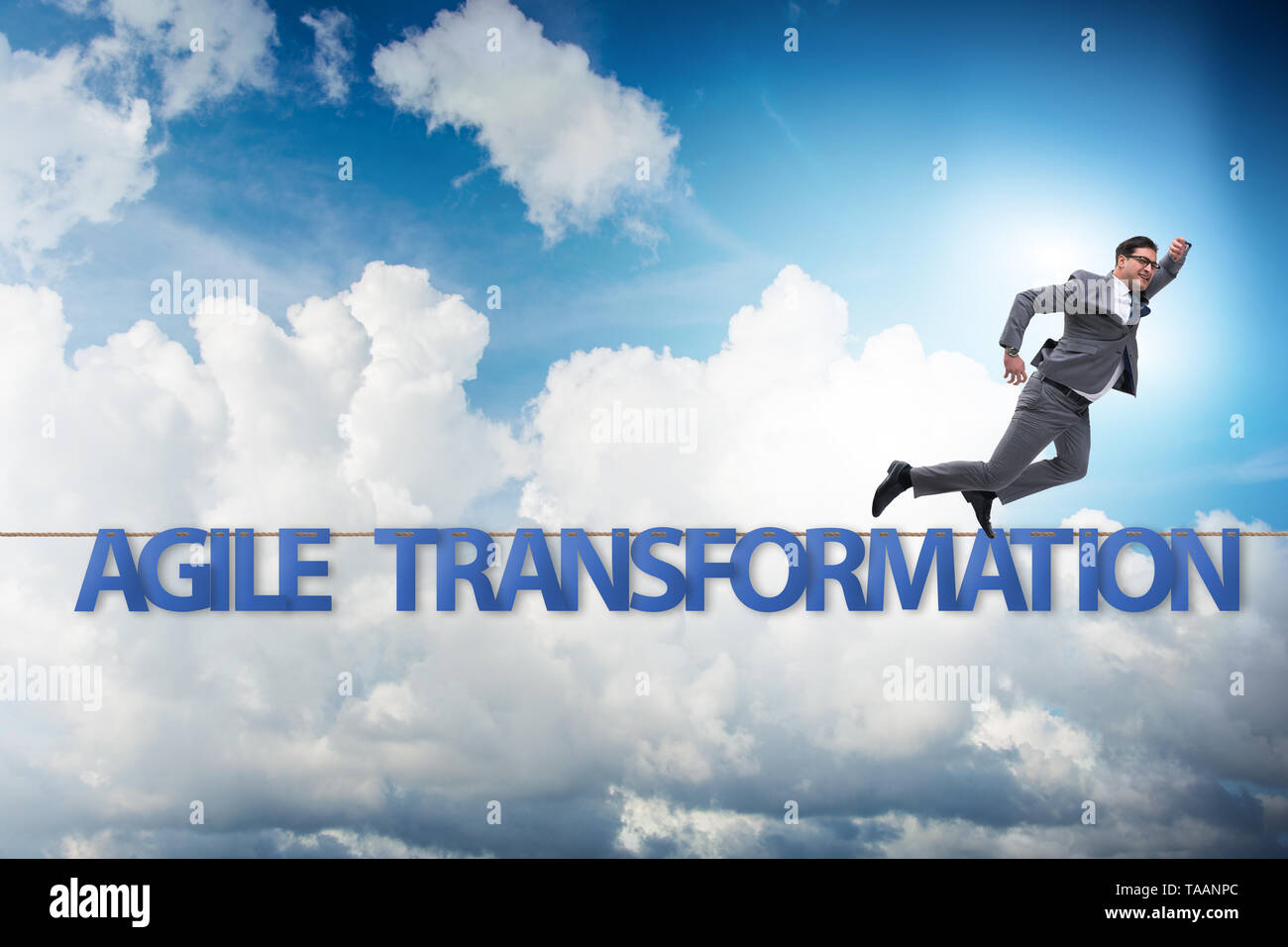 Agile transformation concept with businessman walking on tight rope ...