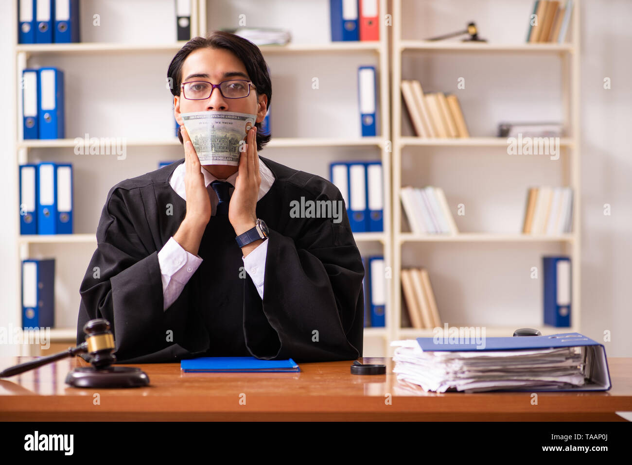 Young handsome judge working in court Stock Photo - Alamy