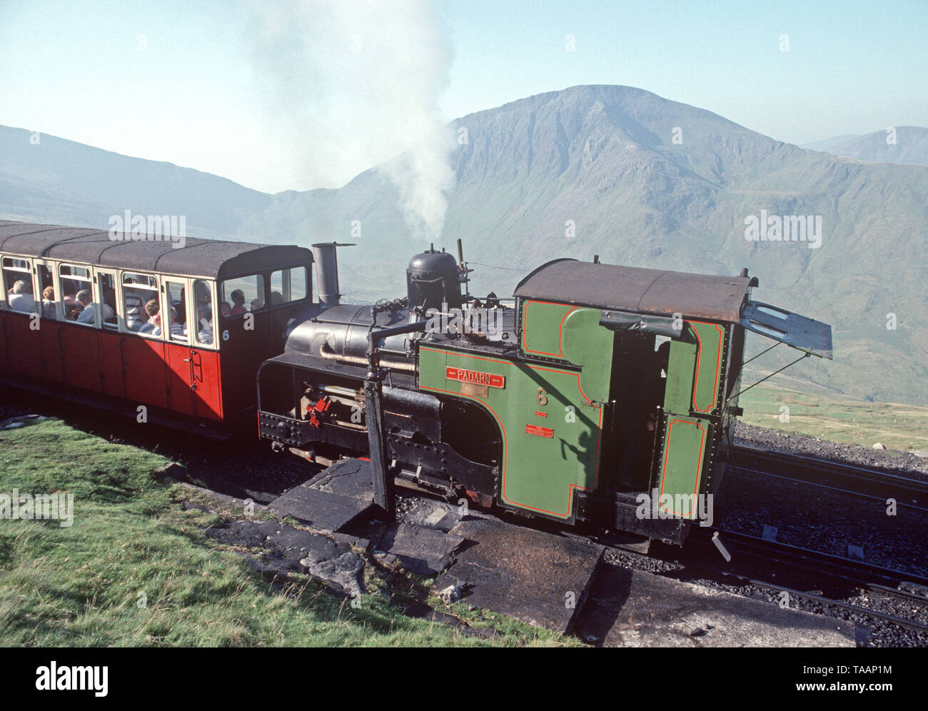 Snowdon Mountain Railway rack and pinion steam locomotive reaching Mount Snowdon summit ...