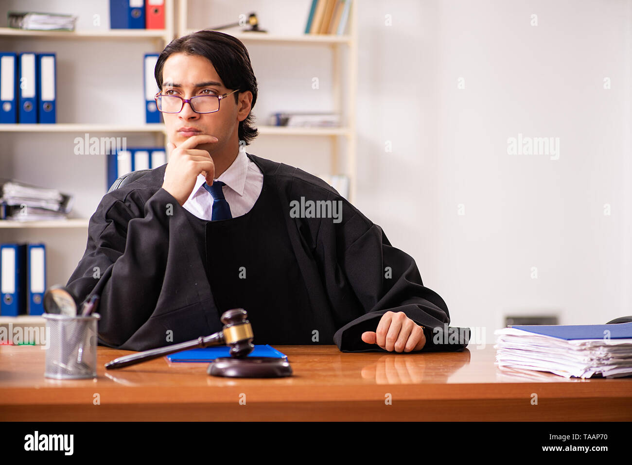 Young handsome judge working in court Stock Photo - Alamy