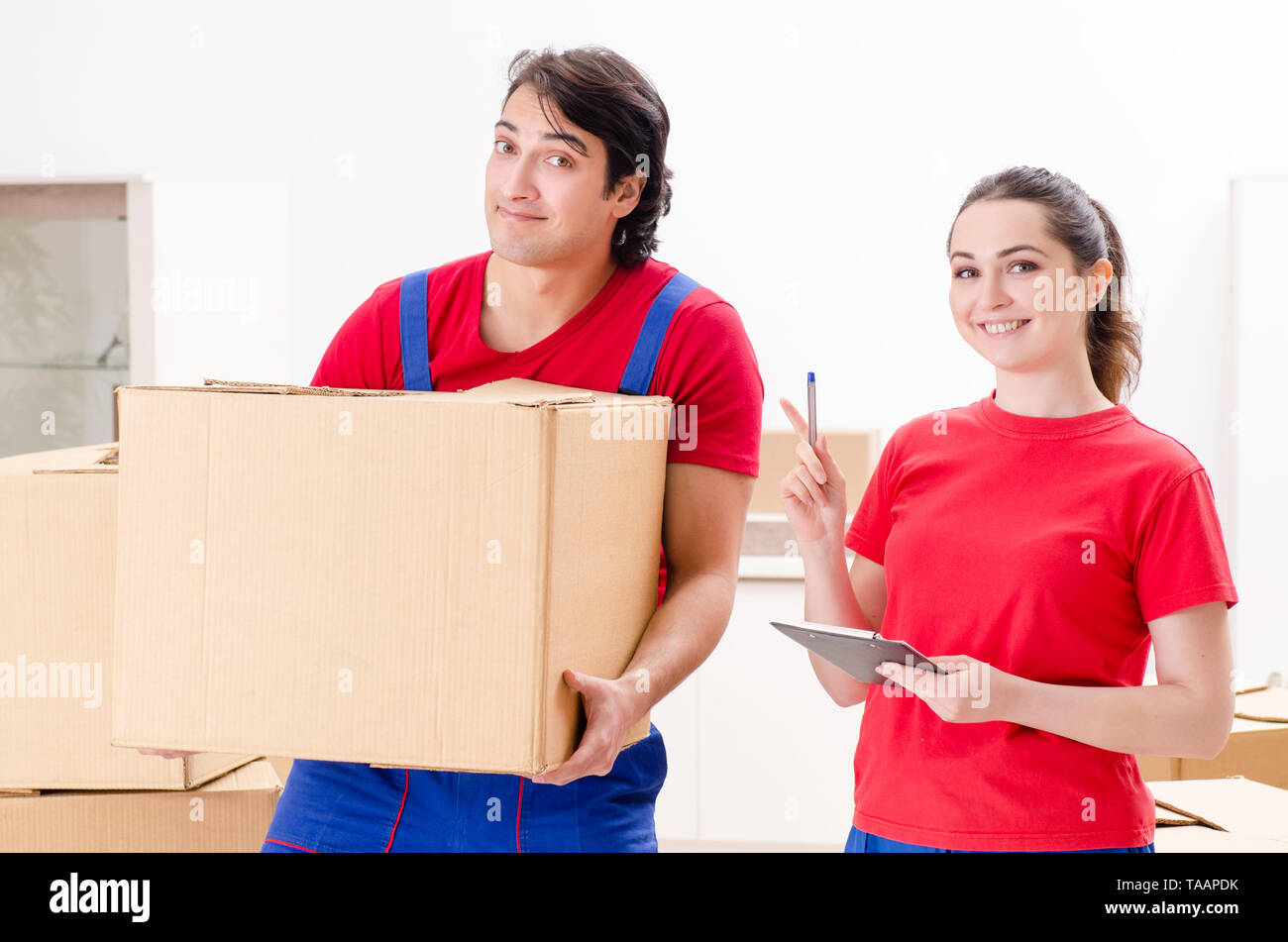 Professional movers doing home relocation Stock Photo - Alamy