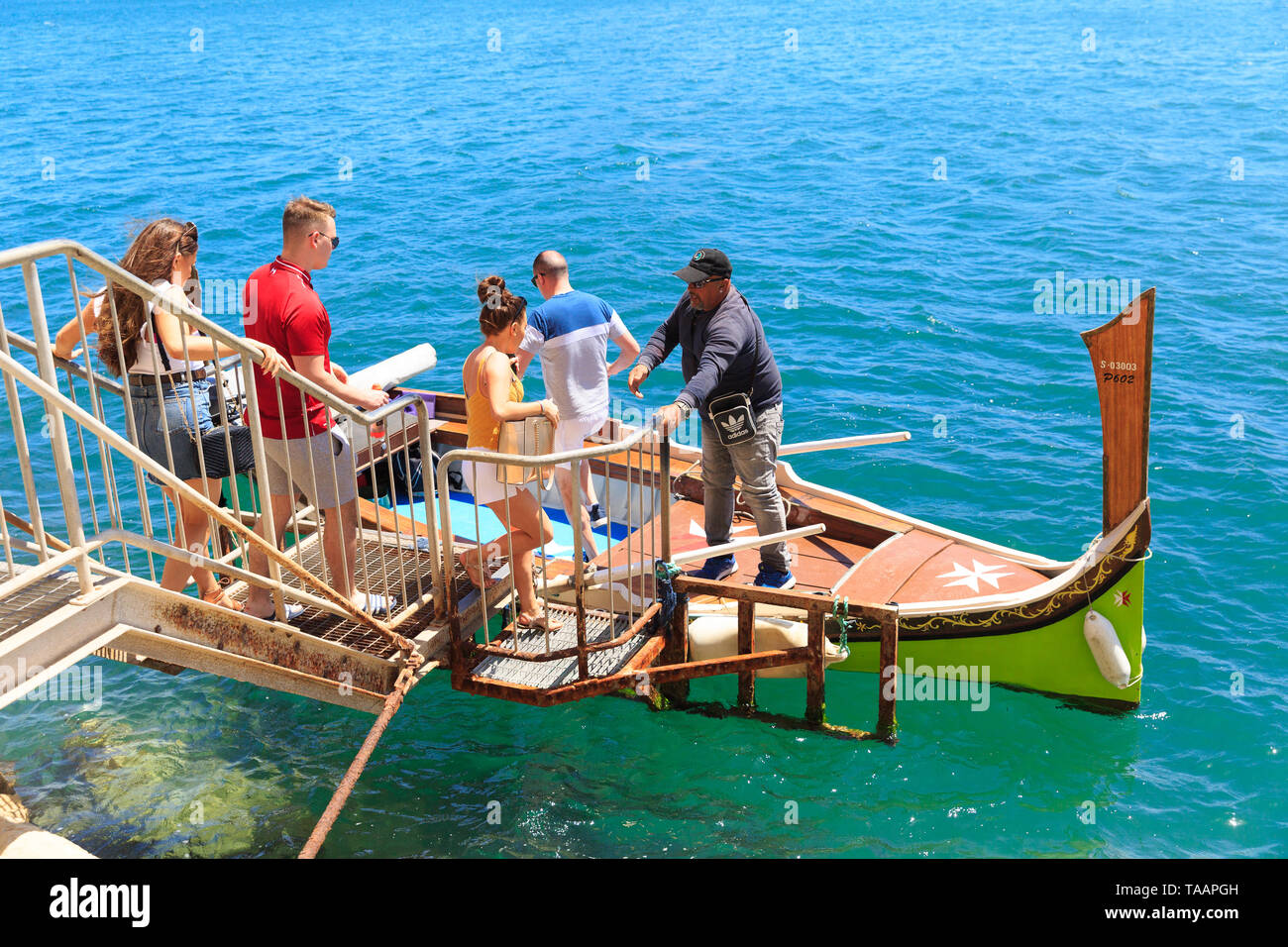 Tourists sit in a gondola for entertaining boat ride Stock Photo - Alamy