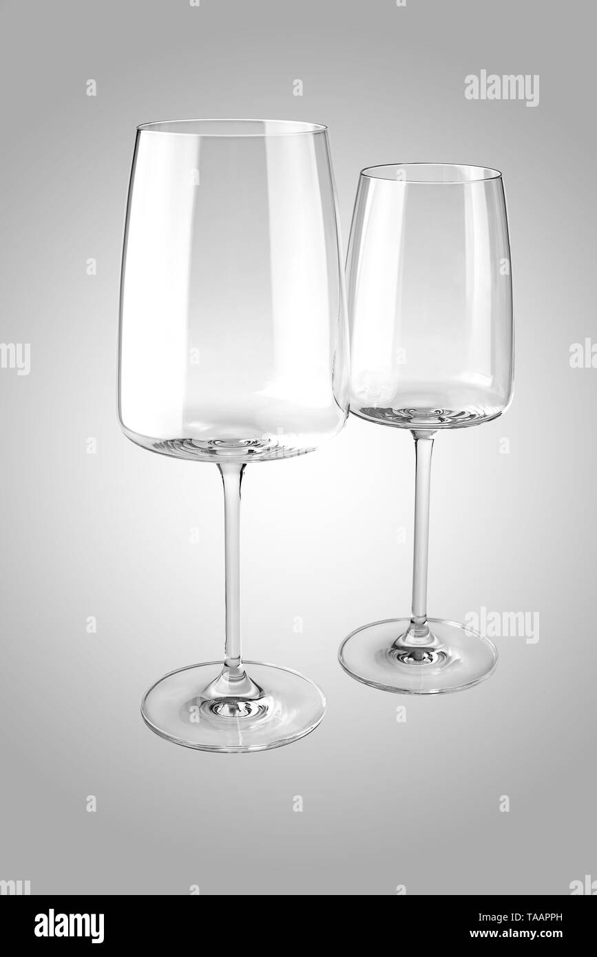 Two empty wine glasses isolated on white Stock Photo - Alamy