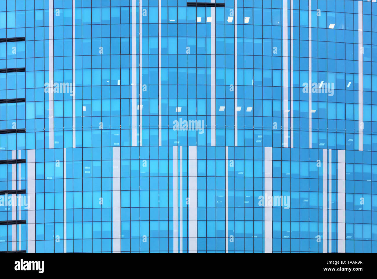 The facade of the glass building of blue glass. Horizontal and vertical ...