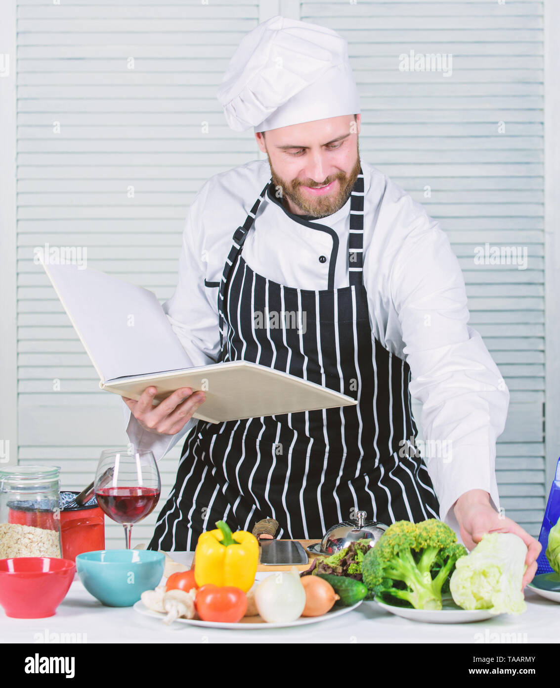 Culinary arts concept. Man learn recipe. Improve cooking skill. Book ...