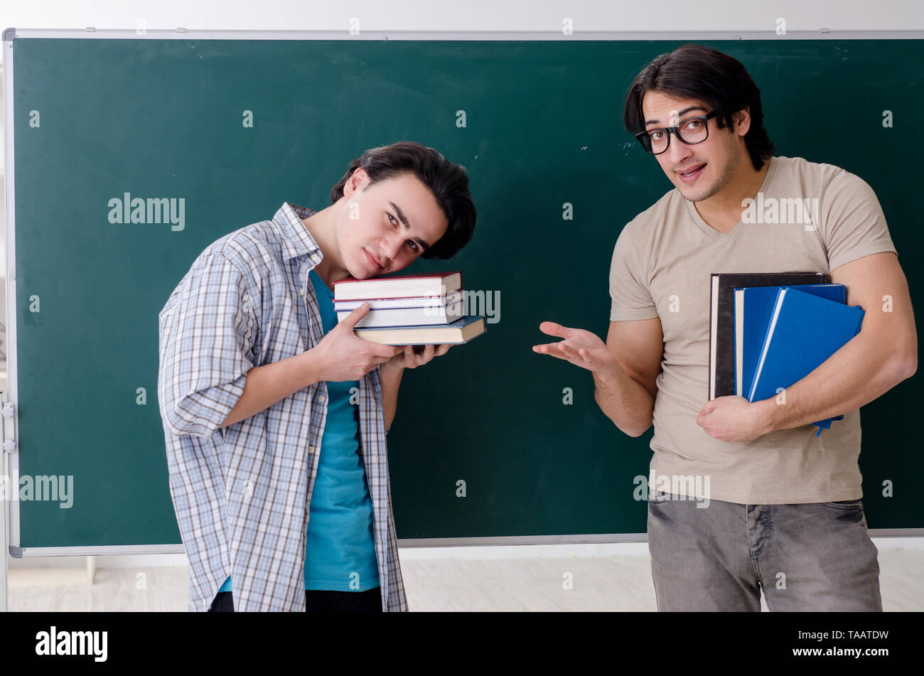 Two male students in the classroom Stock Photo - Alamy