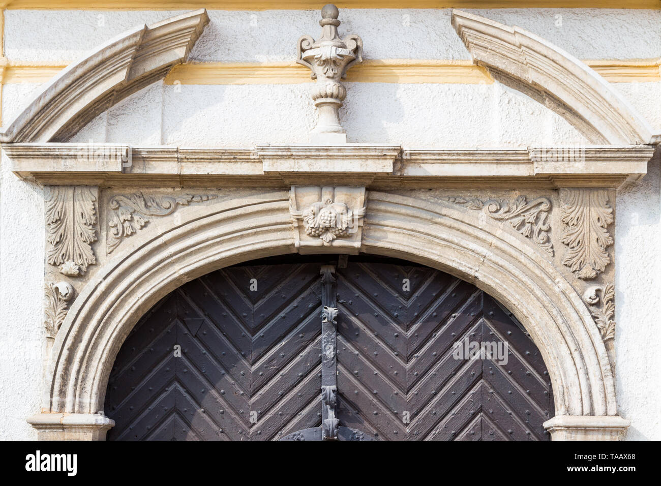 Old keystone of Baroque house gate with grape ornament Stock Photo - Alamy