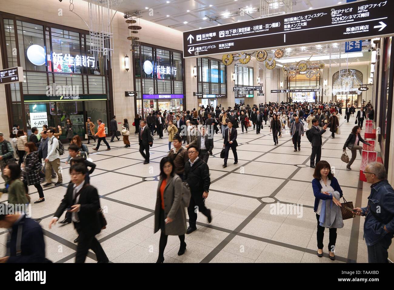 OSAKA, JAPAN - NOVEMBER 22, 2016: Passengers hurry at Hankyu Umeda ...