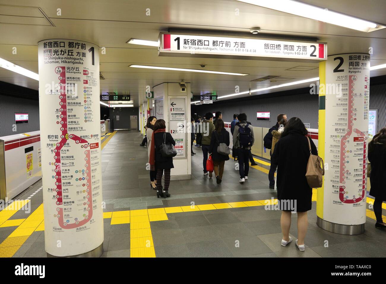 TOKYO, JAPAN - NOVEMBER 30, 2016: People wait at Higashi-Shinjuku ...