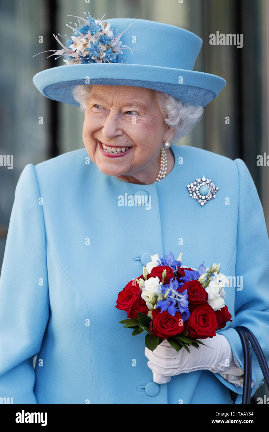 Queen Elizabeth II smiles during a visit to the headquarters of British ...
