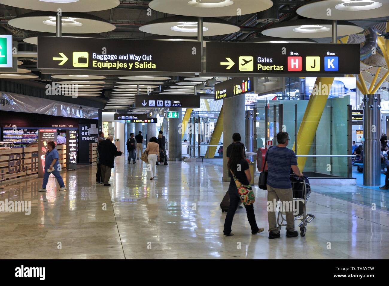 MADRID, SPAIN - OCTOBER 20, 2014: Passengers visit Terminal 4 of Madrid ...