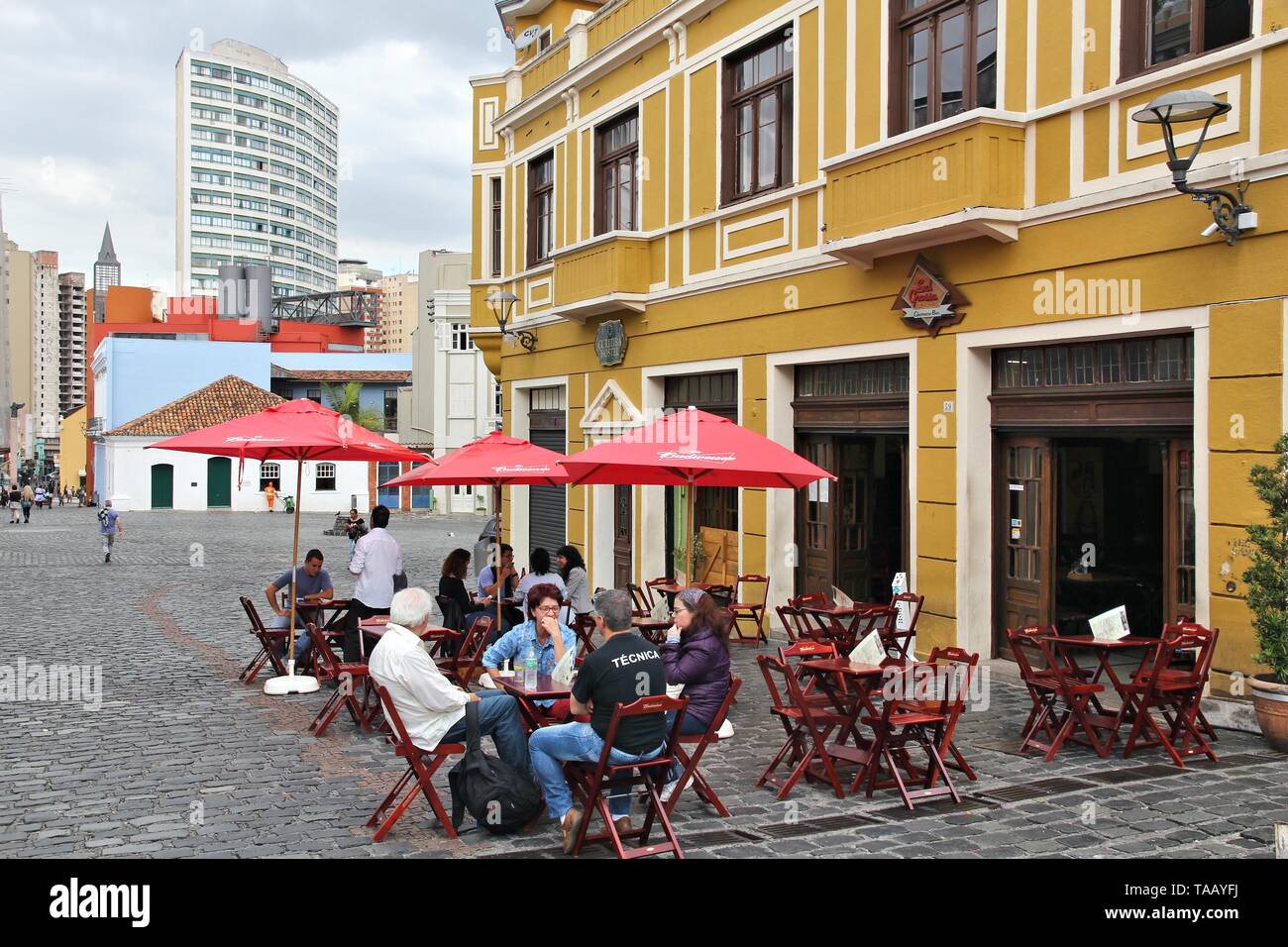 CURITIBA, BRAZIL - OCTOBER 7, 2014: People visit a cafe in the Old Town ...