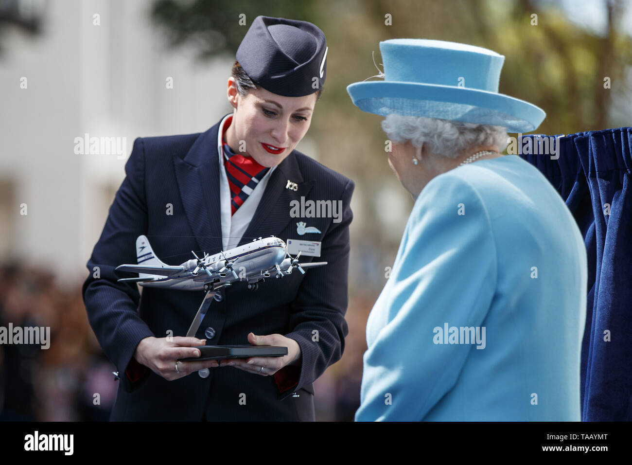 Queen Elizabeth II is presented a model plane during her visit to the ...