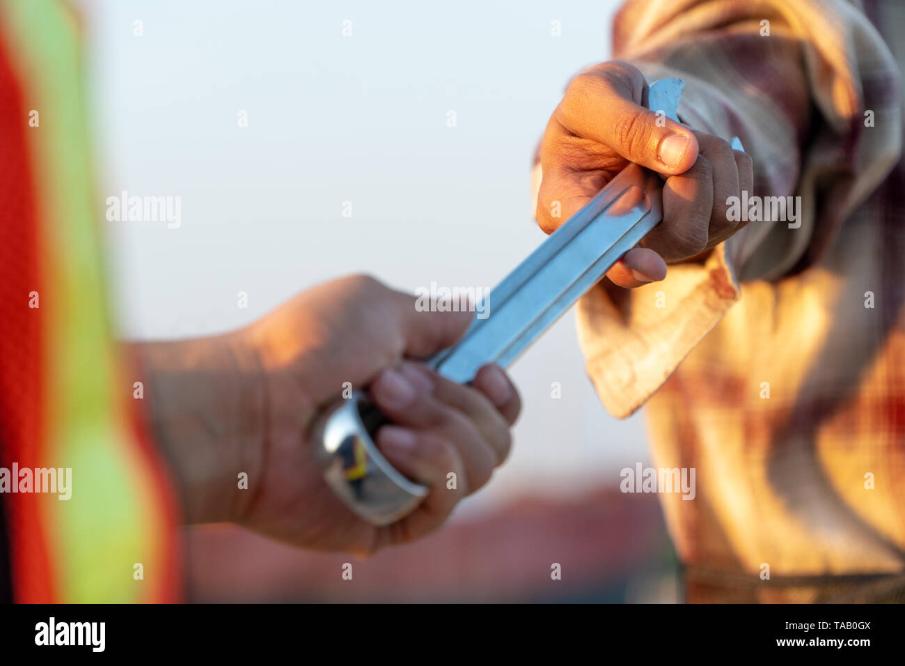 Engineers are submitting equipment to workers. Concepts of teamwork and ...