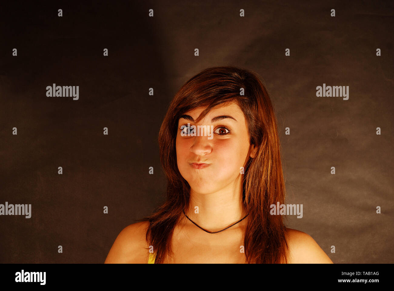 Woman puffing cheeks hi-res stock photography and images - Alamy